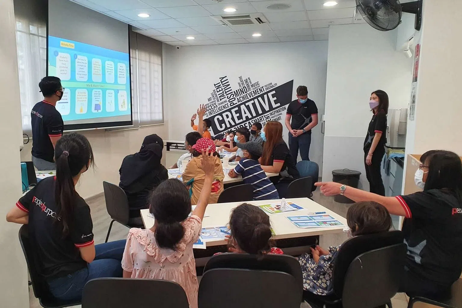 On weekends, these bank staff teach young kids how to manage their money