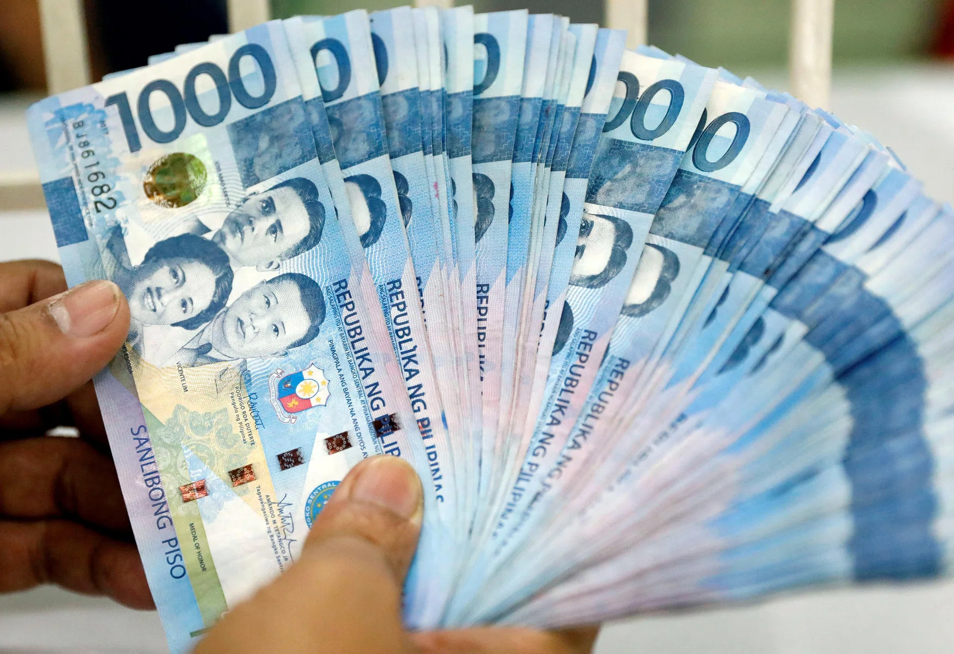 Philippine peso may test record low as central bank cuts rates - The ...