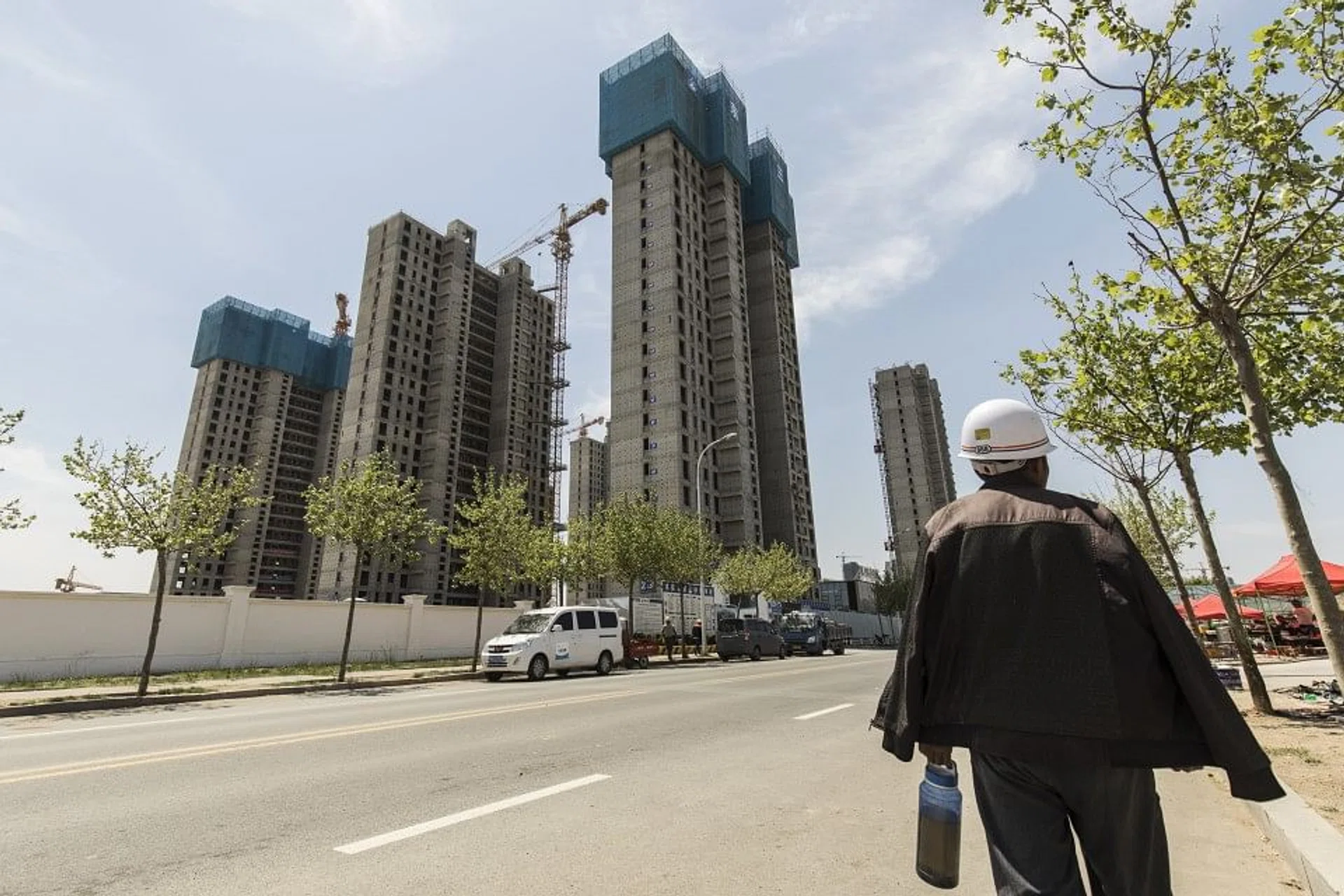 China pledges to tackle housing problem in biggest cities - The ...