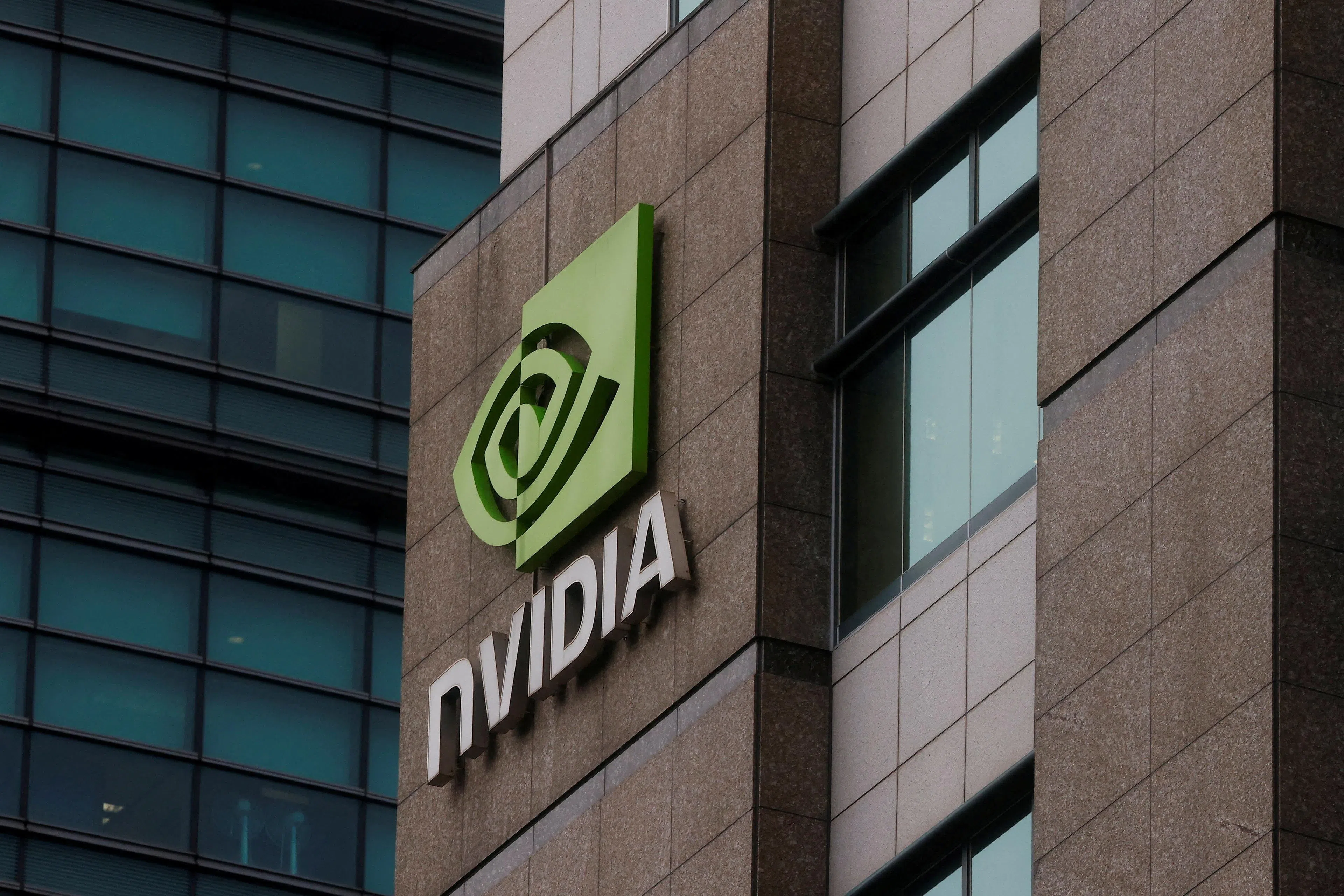 Nvidia hits record high as AI boom lifts bets on another strong ...