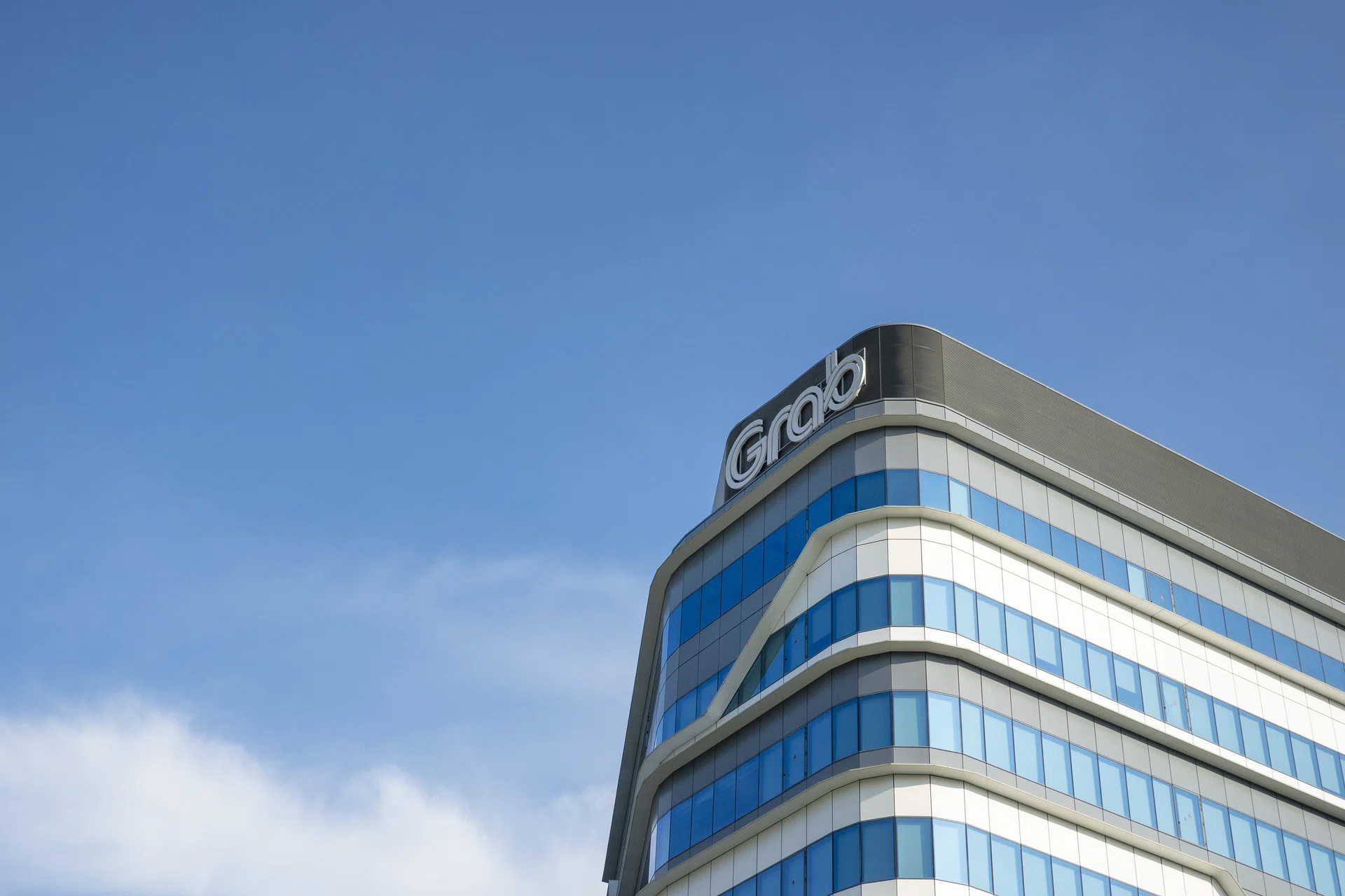 Grab launches investment product Earn+, brings financial services under ...