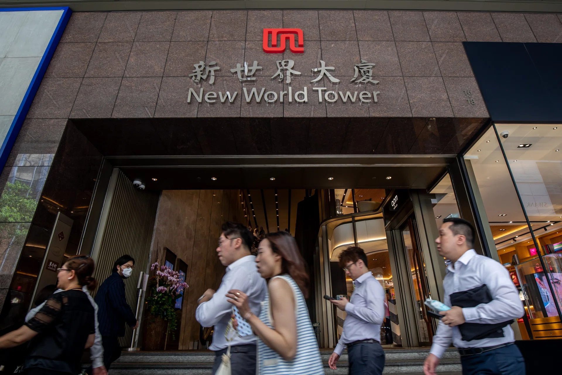 Shares in Hong Kong's New World Development plunge after loss estimate ...