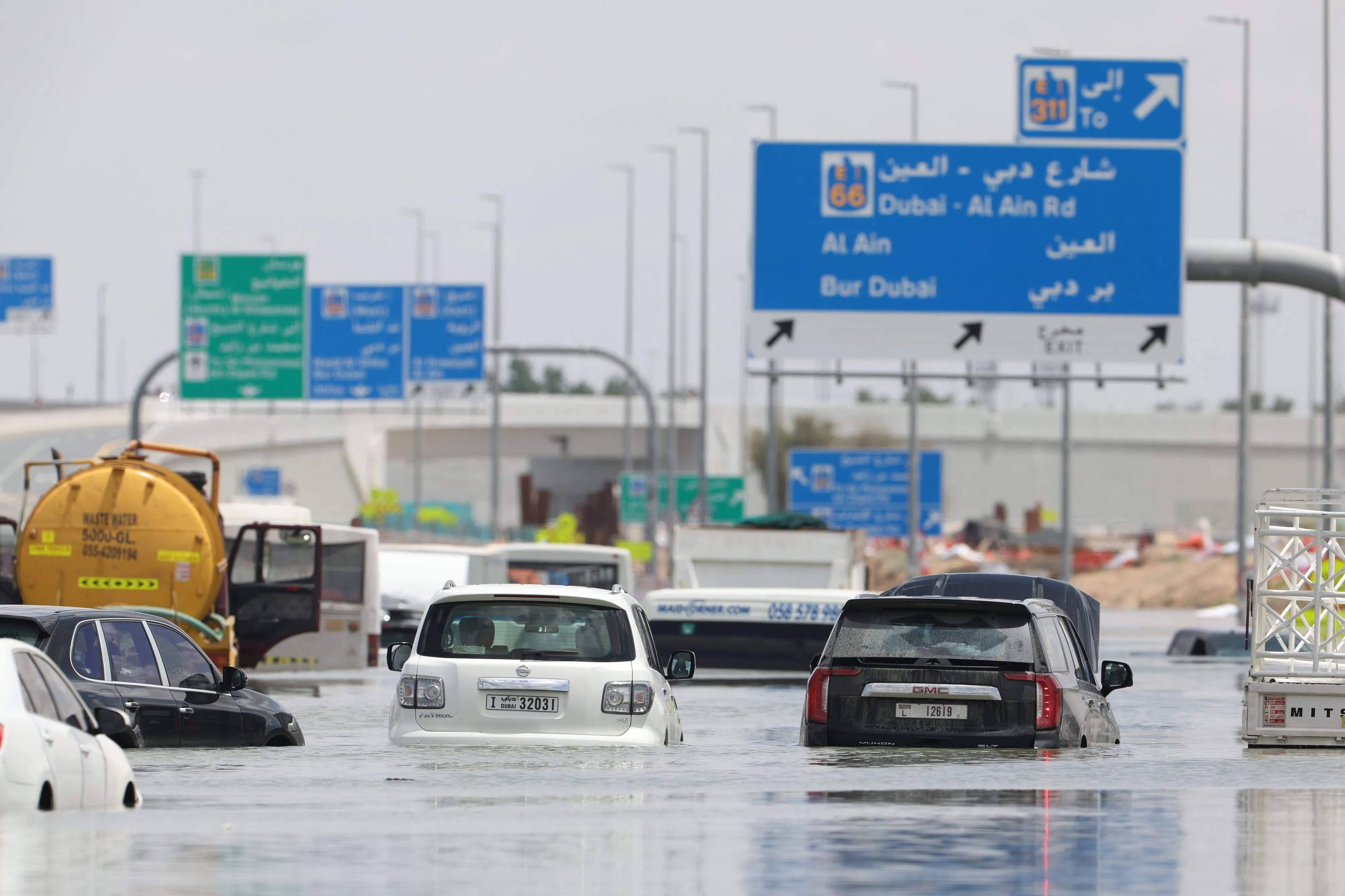 Dubai’s record rain floods expensive homes and halts flights - The ...