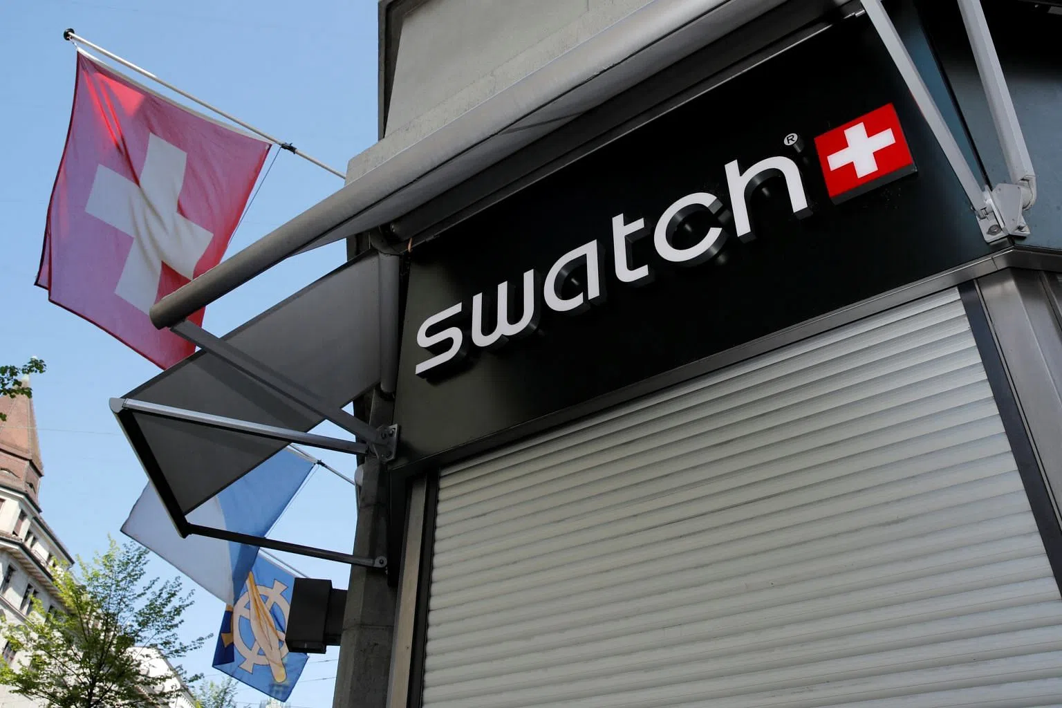Swatch Group sales almost halve, posts net loss in first half - The ...