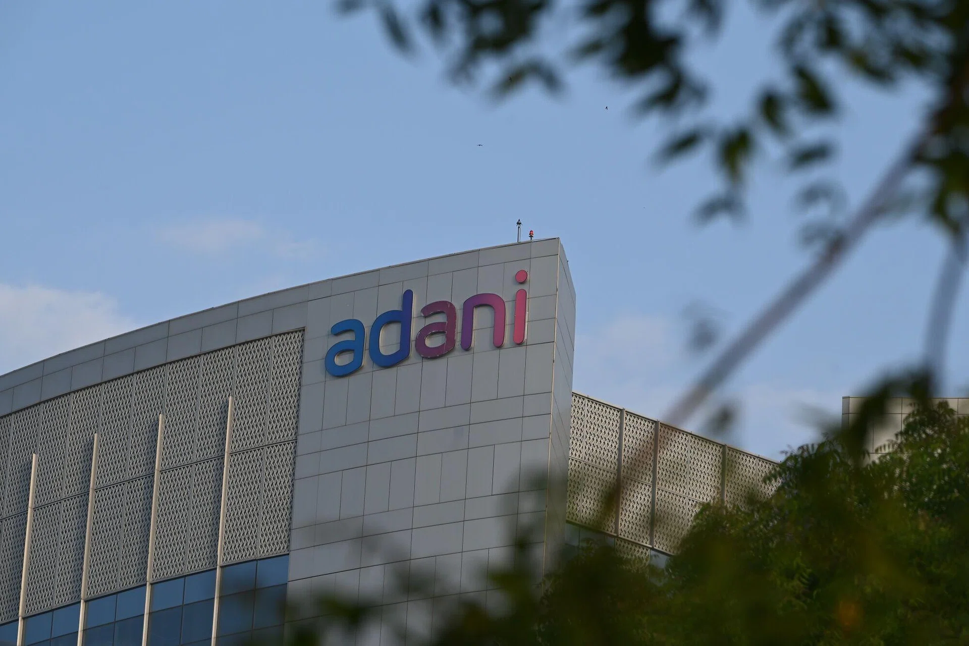Adani Green weighs raising 123 billion rupees to fund expansion ...
