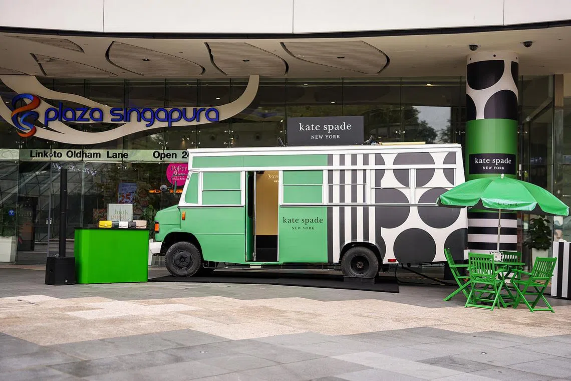 From fun games to owning a new “It bag”: Hop on this pop-up bus for a ...
