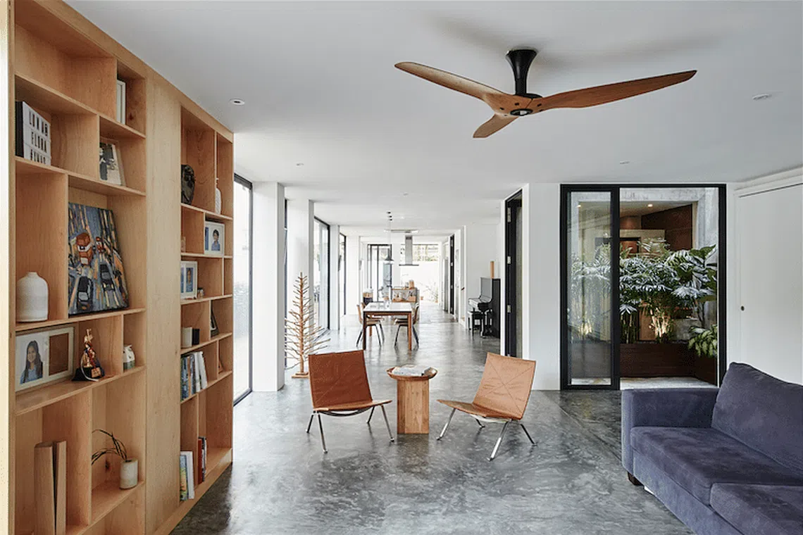 House Tour: There are two air wells in this four-bedroom, two-storey ...