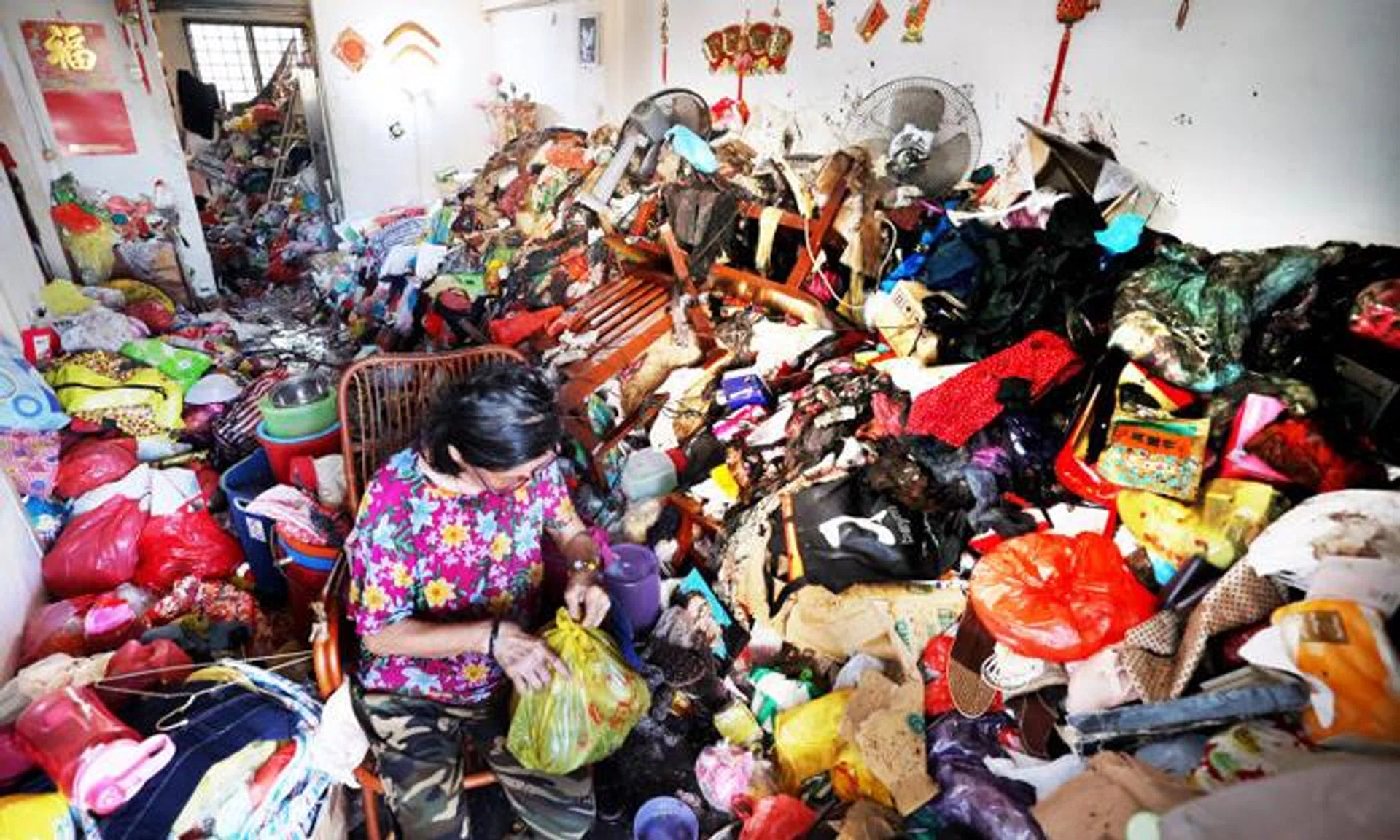 12 rubbish bins worth of items cleared from elderly hoarder's Whampoa ...