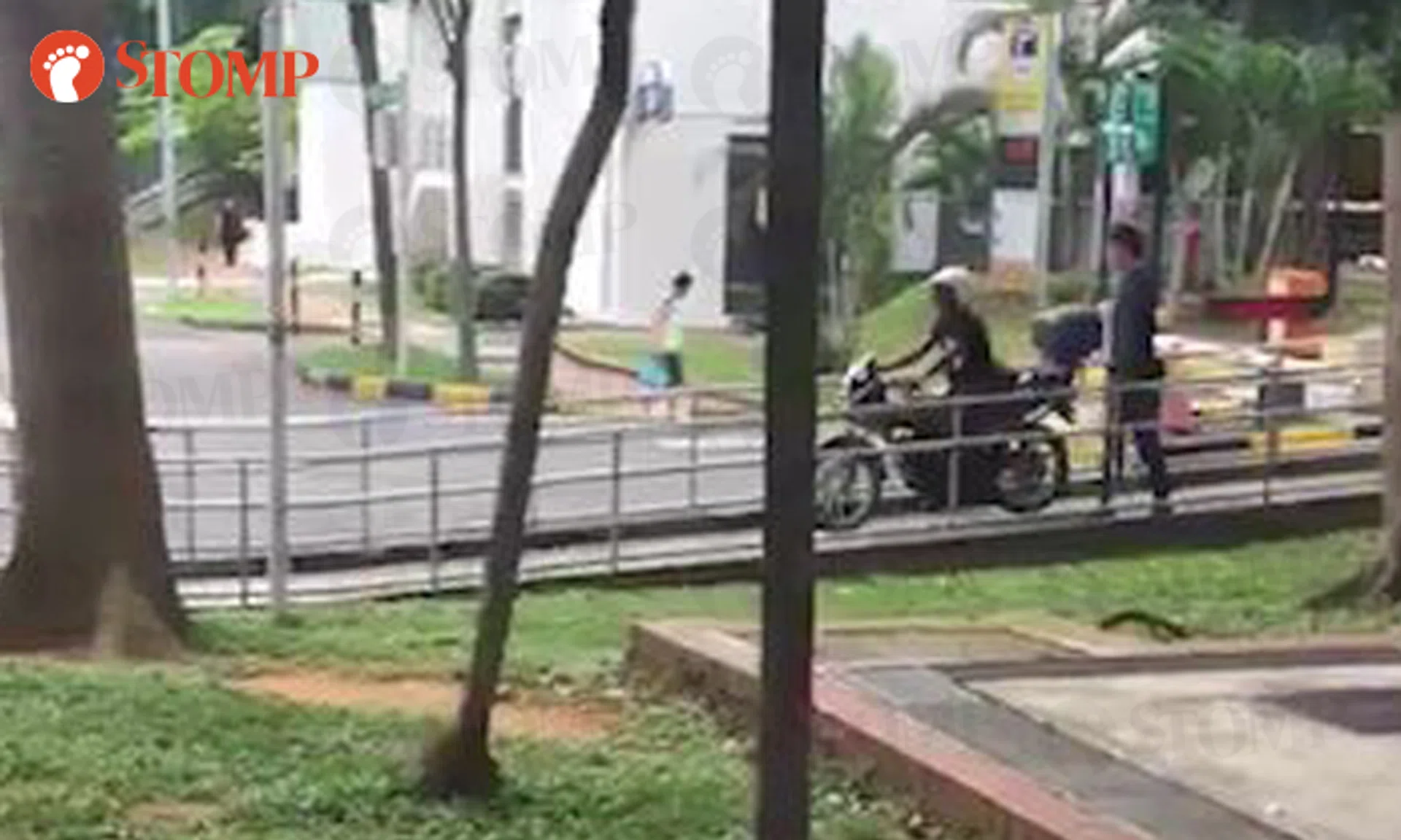 Biker rides on pedestrian pavement to avoid paying fee at carpark ...