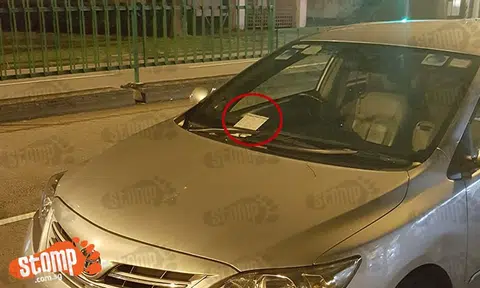 Try and count how many 'saman' slips are on this car parked along ...