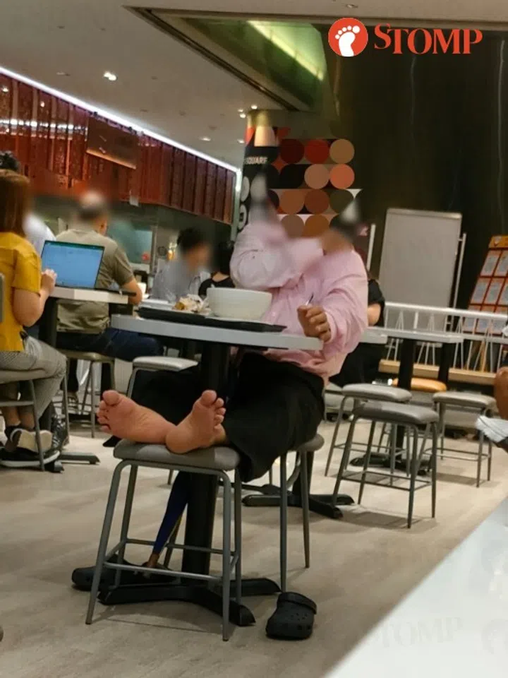 Sole disgusting: Man in Toast Box and woman in Starbucks rest their ...