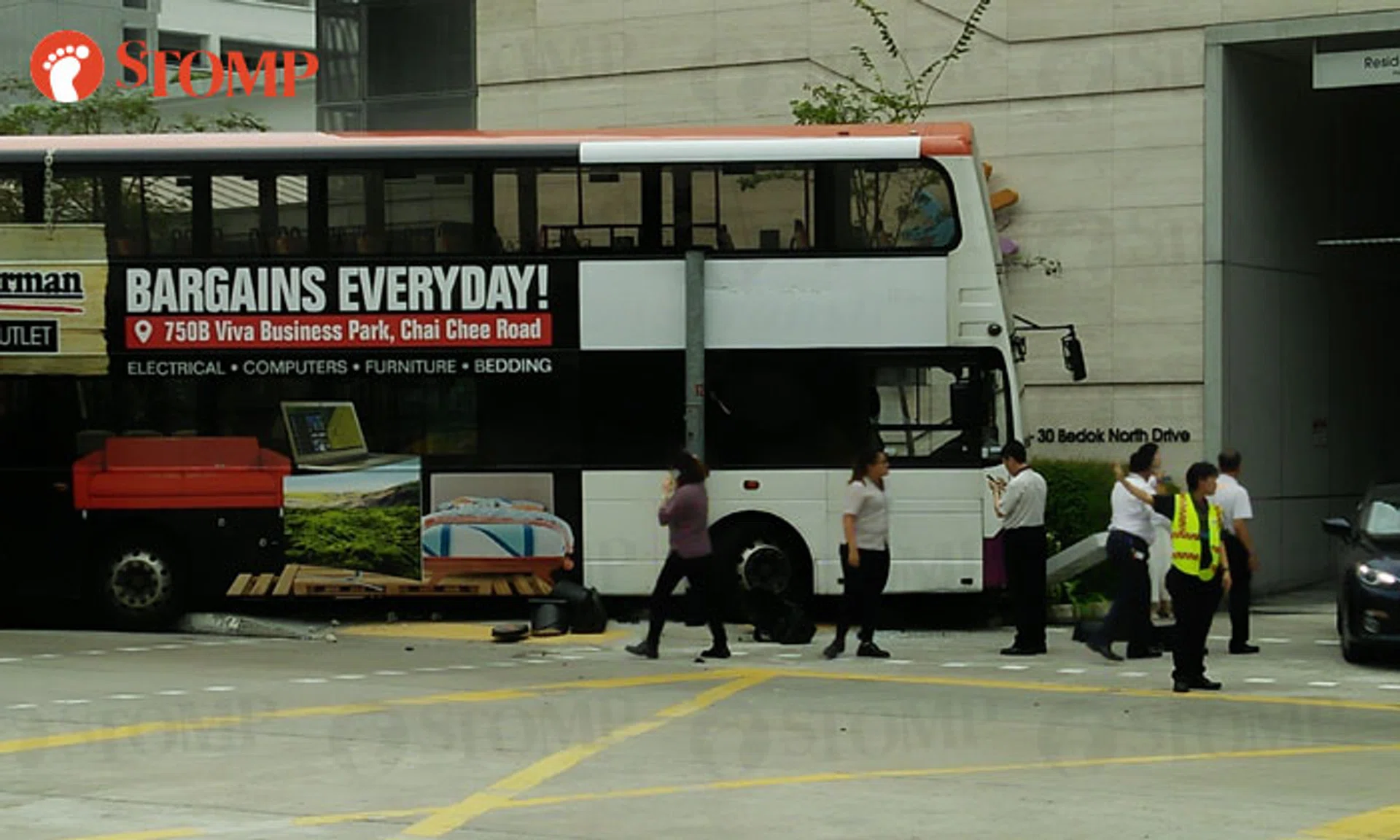 Woman trapped under bus in accident at Bedok North Dr, 3 others injured ...
