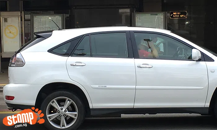 Lexus driver uses handphone while driving along North Bridge Road | STOMP