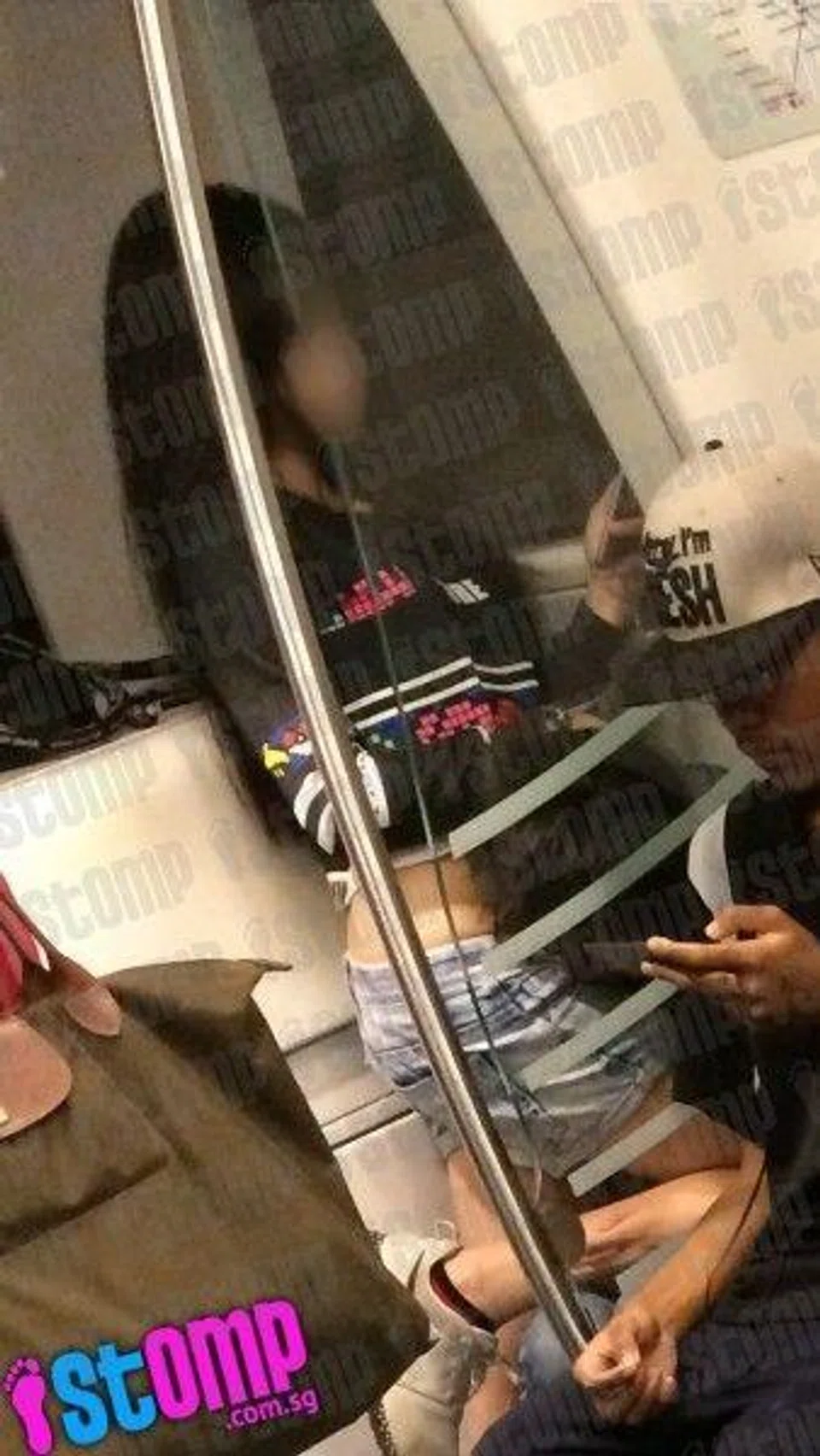Young couple cannot keep their hands off each other on board MRT train ...
