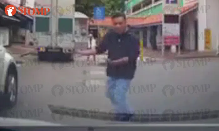 Man dashes out in front of car, gestures angrily at driver who e-braked ...