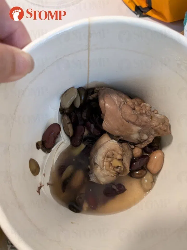 Soup spilled after package slipped off S-hook during delivery, no full ...