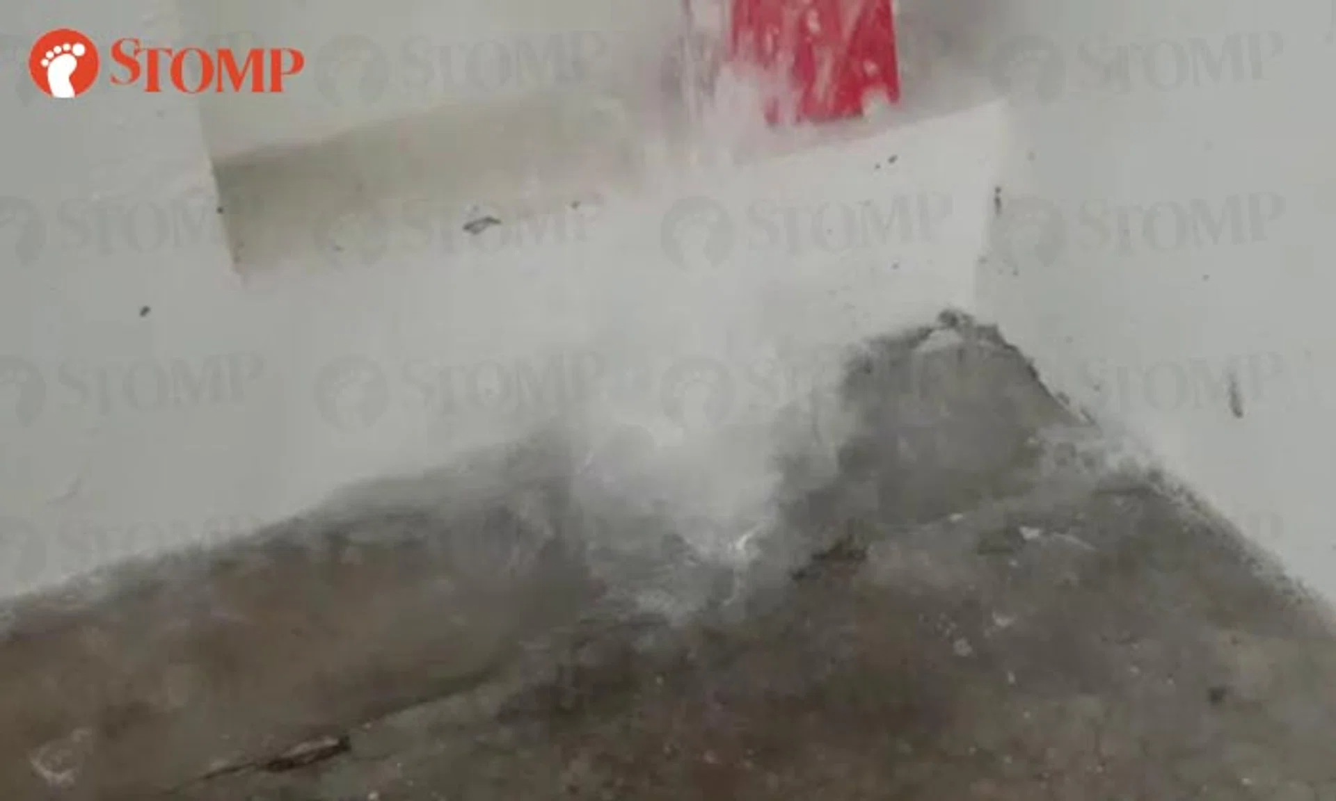 Water gushing out of pipe at Jurong West block due to chokage during ...