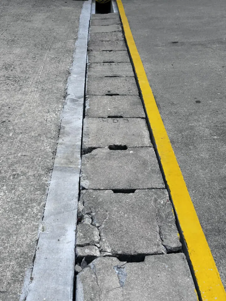 Man hurt in fall when his wheelchair gets caught in cracked drain cover ...