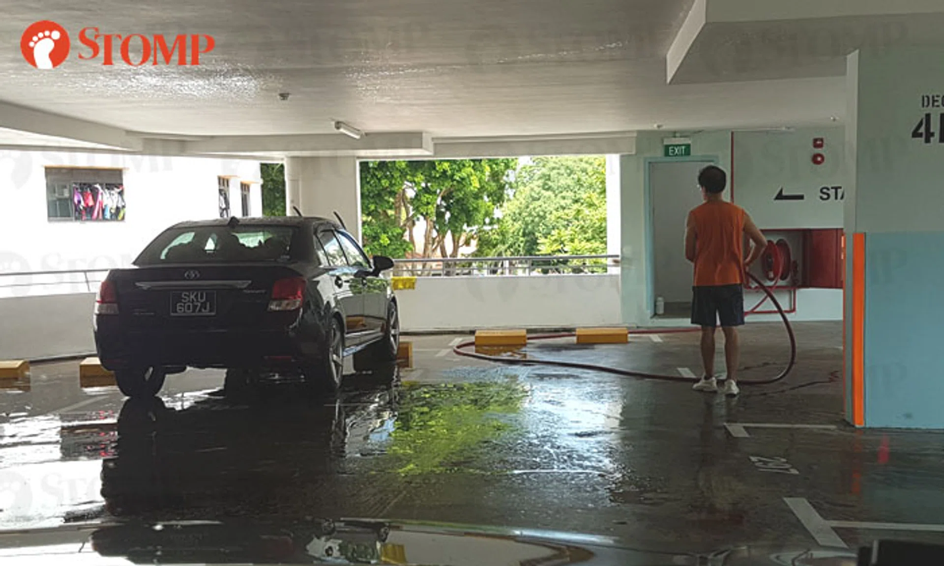 Man uses fire hose reel to wash car at Bedok..., Latest News - STOMP