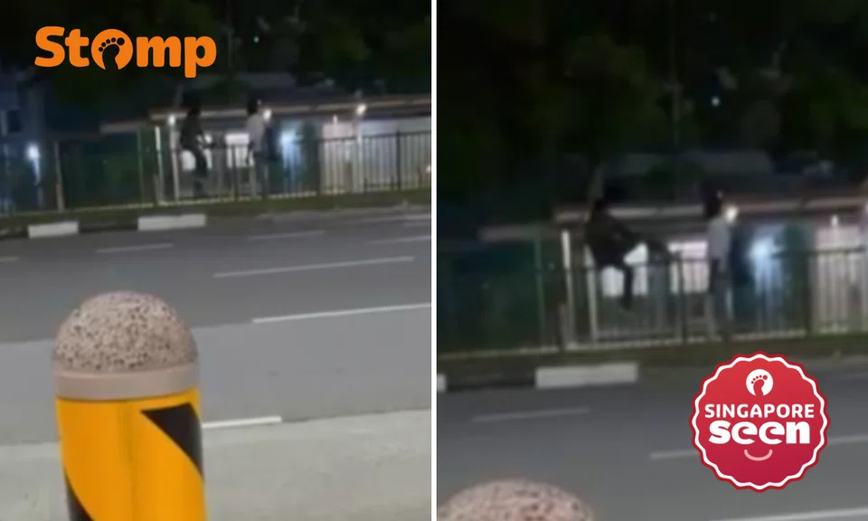 Two men climb over road divider near Nibong LRT station -- when ...