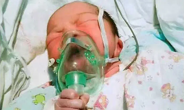 Photos of newborn holding oxygen mask go viral | STOMP