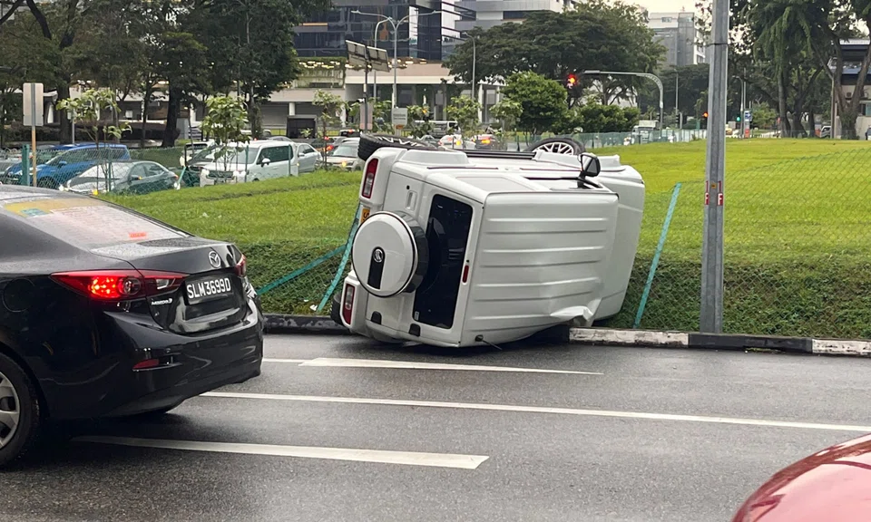 Motorists gawk at overturned vehicle resting on its side in Eunos | STOMP