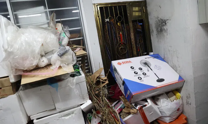 Hoarder climbs through window to get into Hougang flat: Clutter even ...