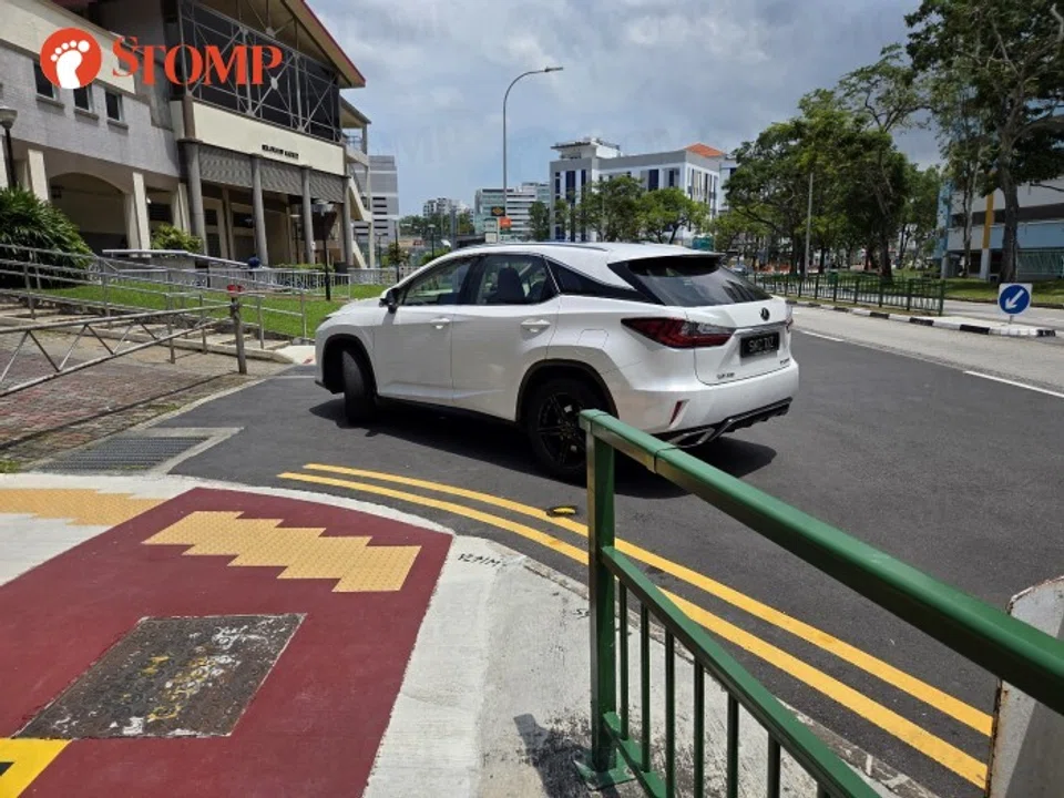 Several motorcycles park on double yellow lines, blocking pedestrian ...