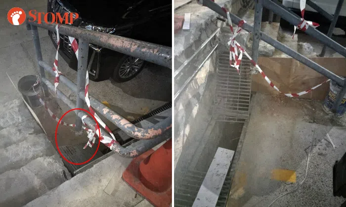 Uneven staircase with broken railing next to uncovered drain might be ...