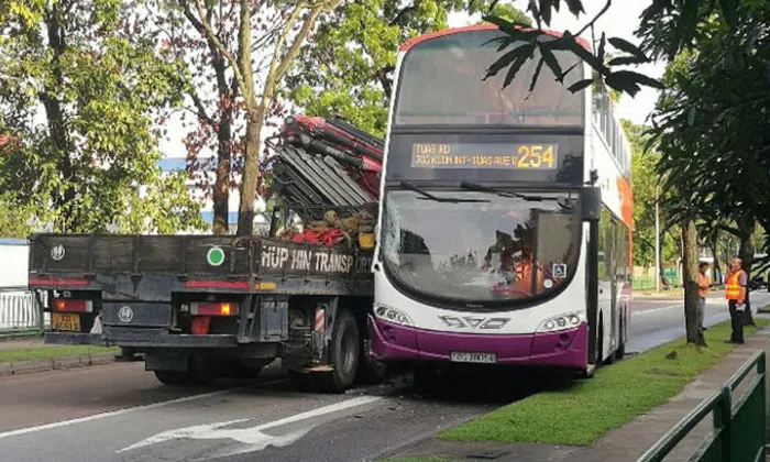 Lorry driver arrested for drink-driving after crashing into bus in Tuas ...