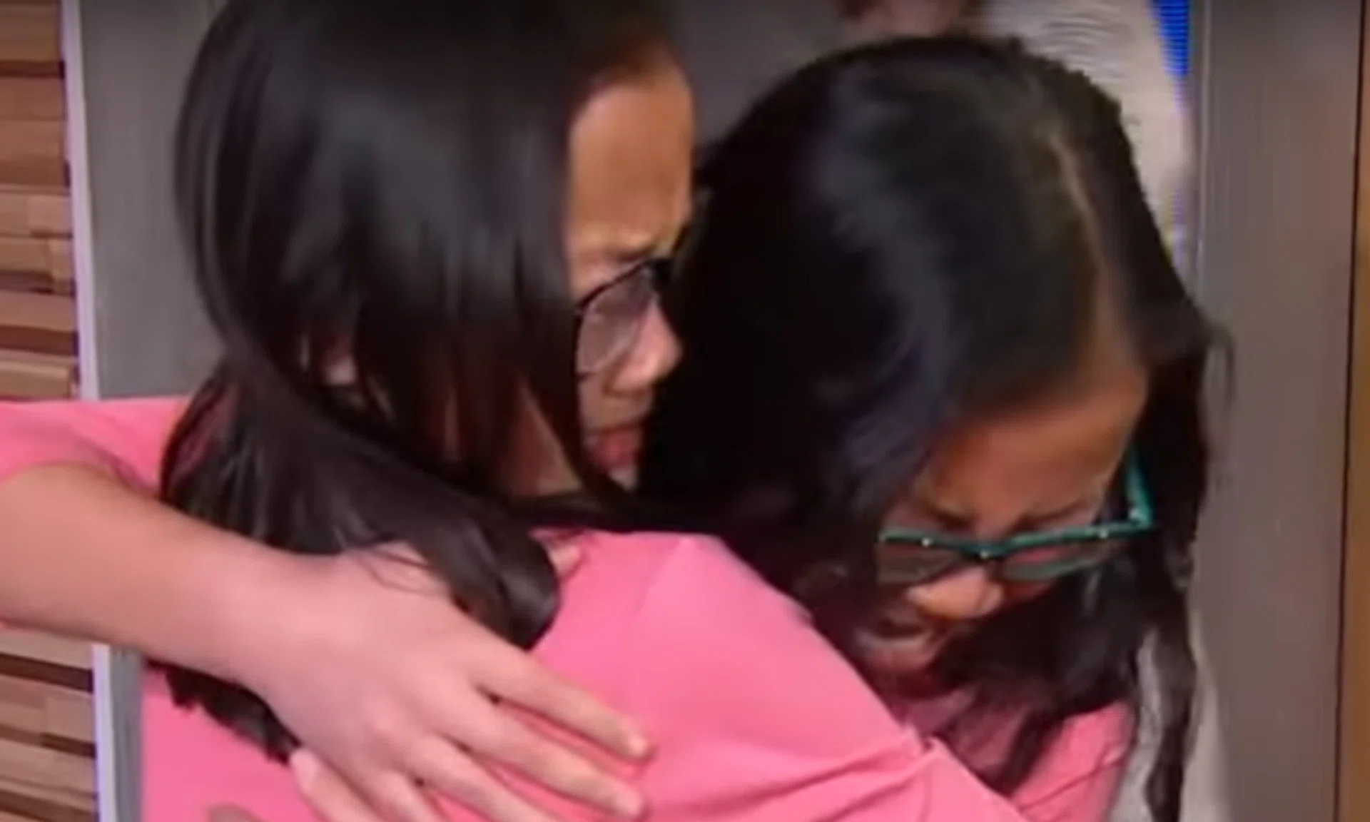 Chinese twin sisters separated from birth share warm embrace at tearful ...