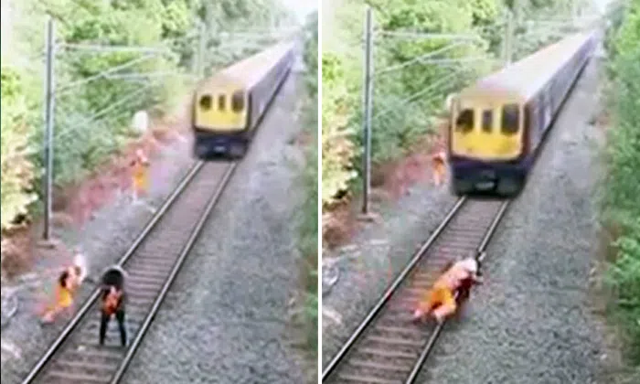 Railway worker puts his life on the line to save man from oncoming ...