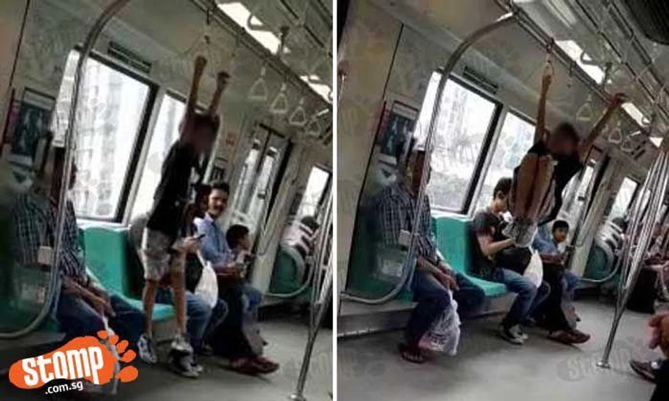 Kid hangs on and swings from handlebars on MRT train -- for 15 minutes ...