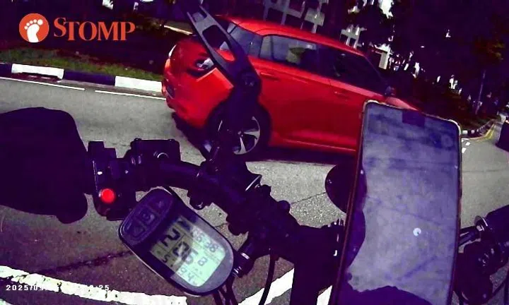 Delivery rider falls off e-bike after braking suddenly to avoid car ...
