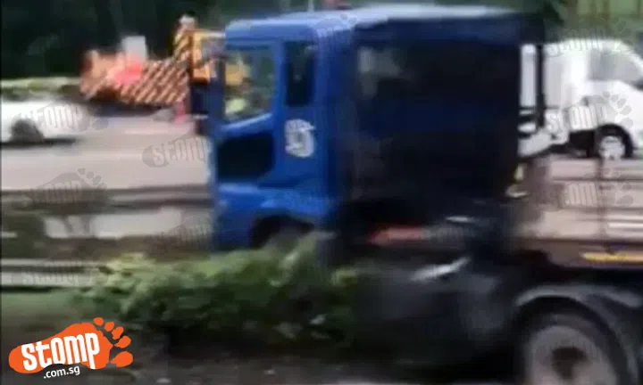 Trailer truck crashes through divider and bushes after accident at SLE ...