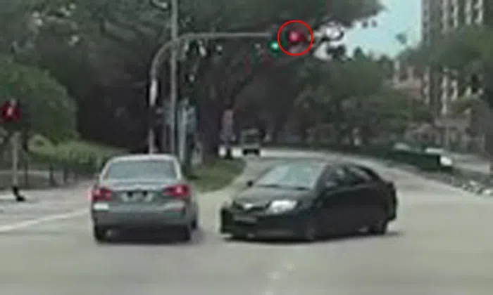 Look how close driver comes to causing accident after running red light ...