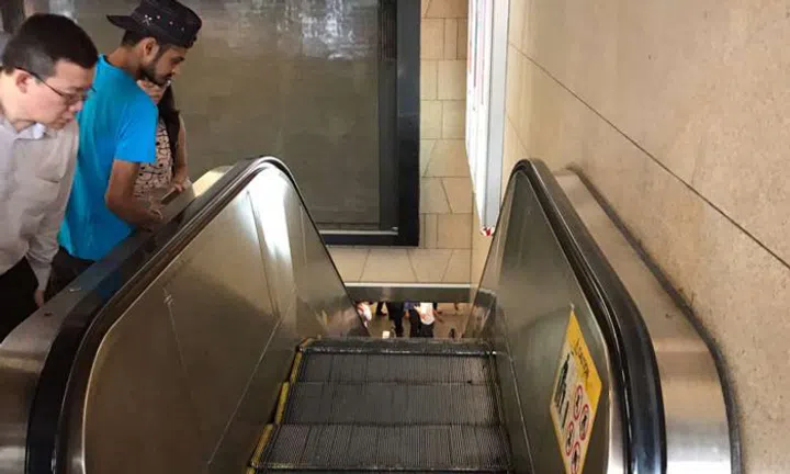 Stroller gets stuck in Raffles Place escalator, dislodges steps | STOMP