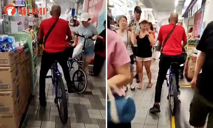 Man rides bicycle through crowd on narrow walkway outside Yishun supermarket | STOMP