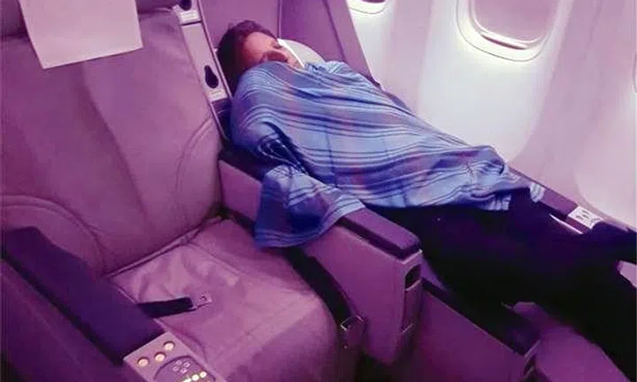 Passenger shocked to find pilot sleeping in business class while ...