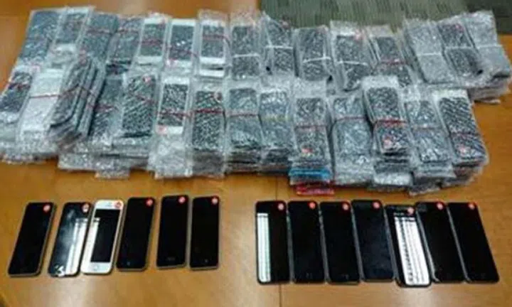 8 men suspected of selling counterfeit mobile phones arrested, over $1. ...