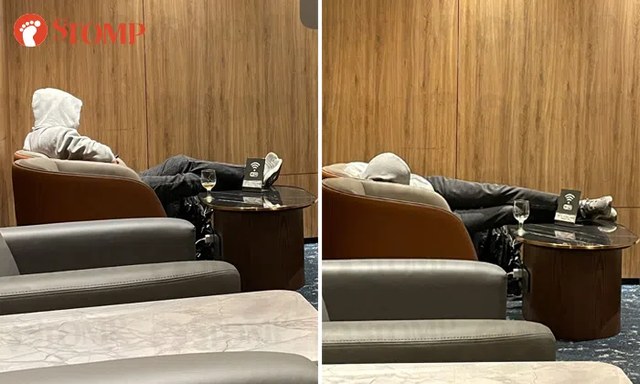 Man places feet on table in SilverKris Lounge at Changi Airport -- and ...