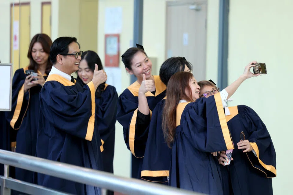 Mark Lee and Marcus Chin attend colleague Dennis Chew's graduation ...