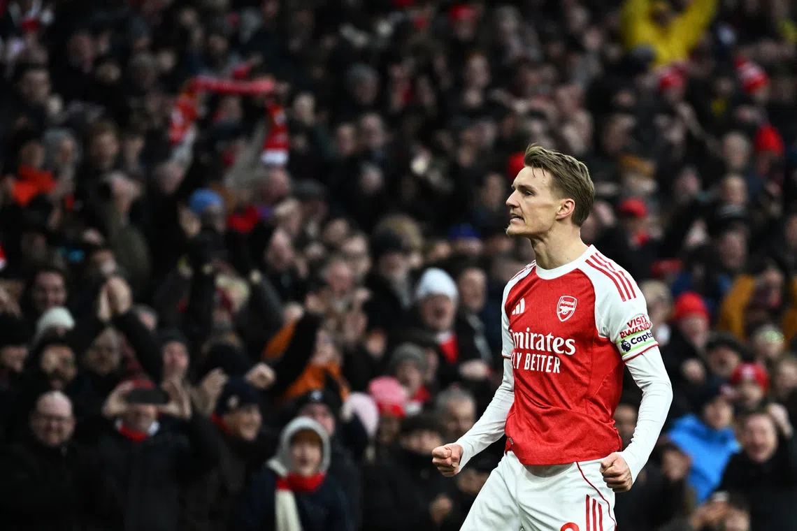 Odegaard back on target as Arsenal reclaim top spot | The Straits Times