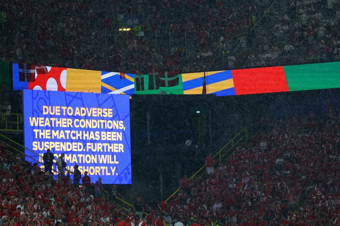 Germany v Denmark resumes after thunderstorm, hail | The Straits Times