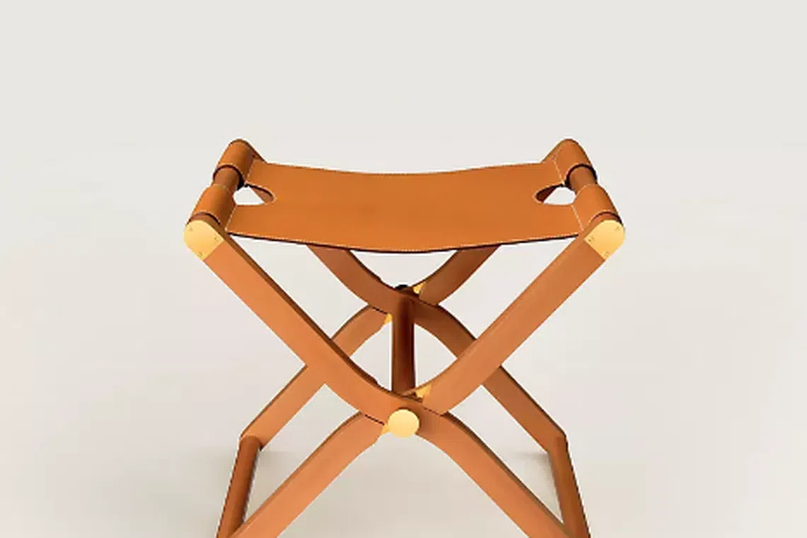 More restaurants are adding tiny purse stools for big luxury handbags ...