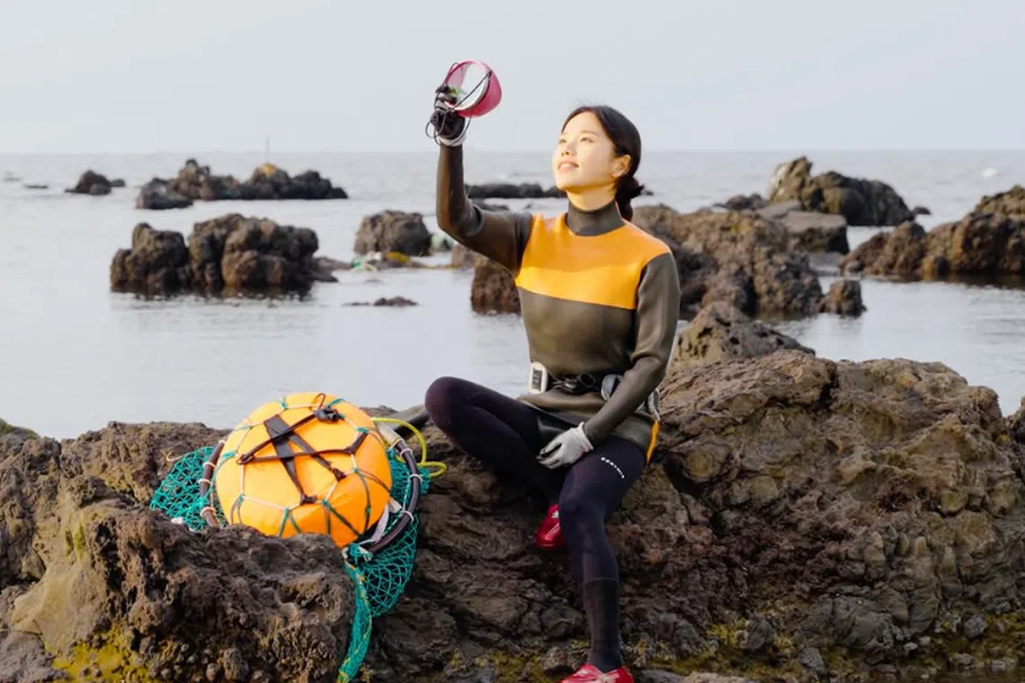 With buoy and camera, 32-year-old diver redefines life as a Jeju ...