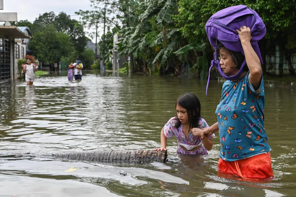Philippine rescuers battle flood waters to reach stranded residents ...