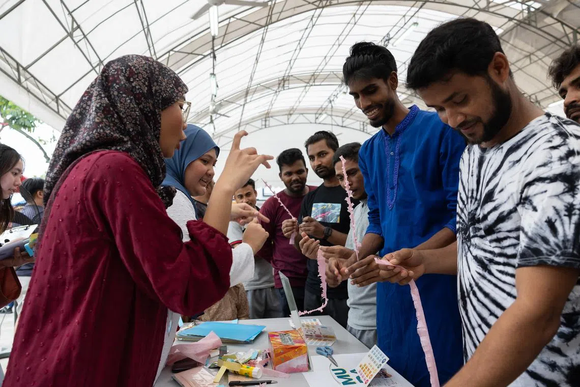 Sharing of cultures as migrant workers and S’poreans mark Racial ...