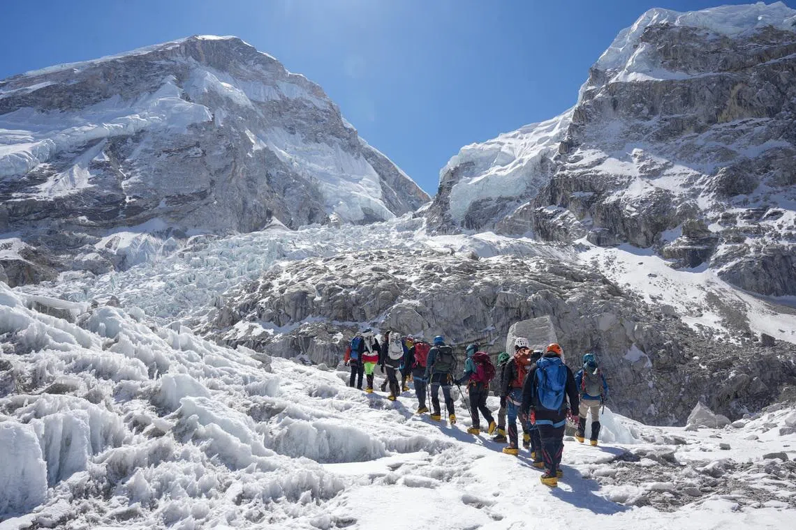 Giant ice tower delays opening of Everest climbing route | The Straits ...