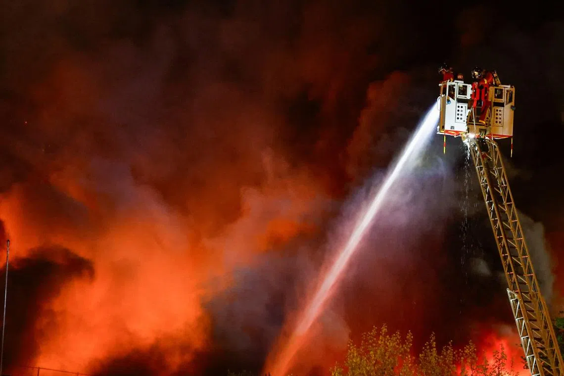200 firefighters battle major Paris inferno | The Straits Times
